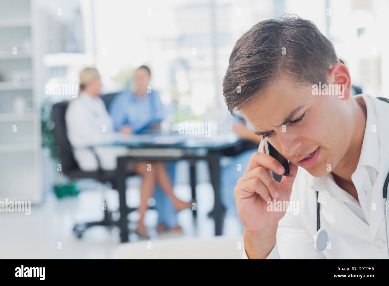Doctor calling hi-res stock photography and images - Alamy