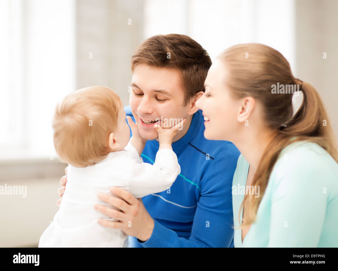 happy parents playing with adorable baby Stock Photo - Alamy