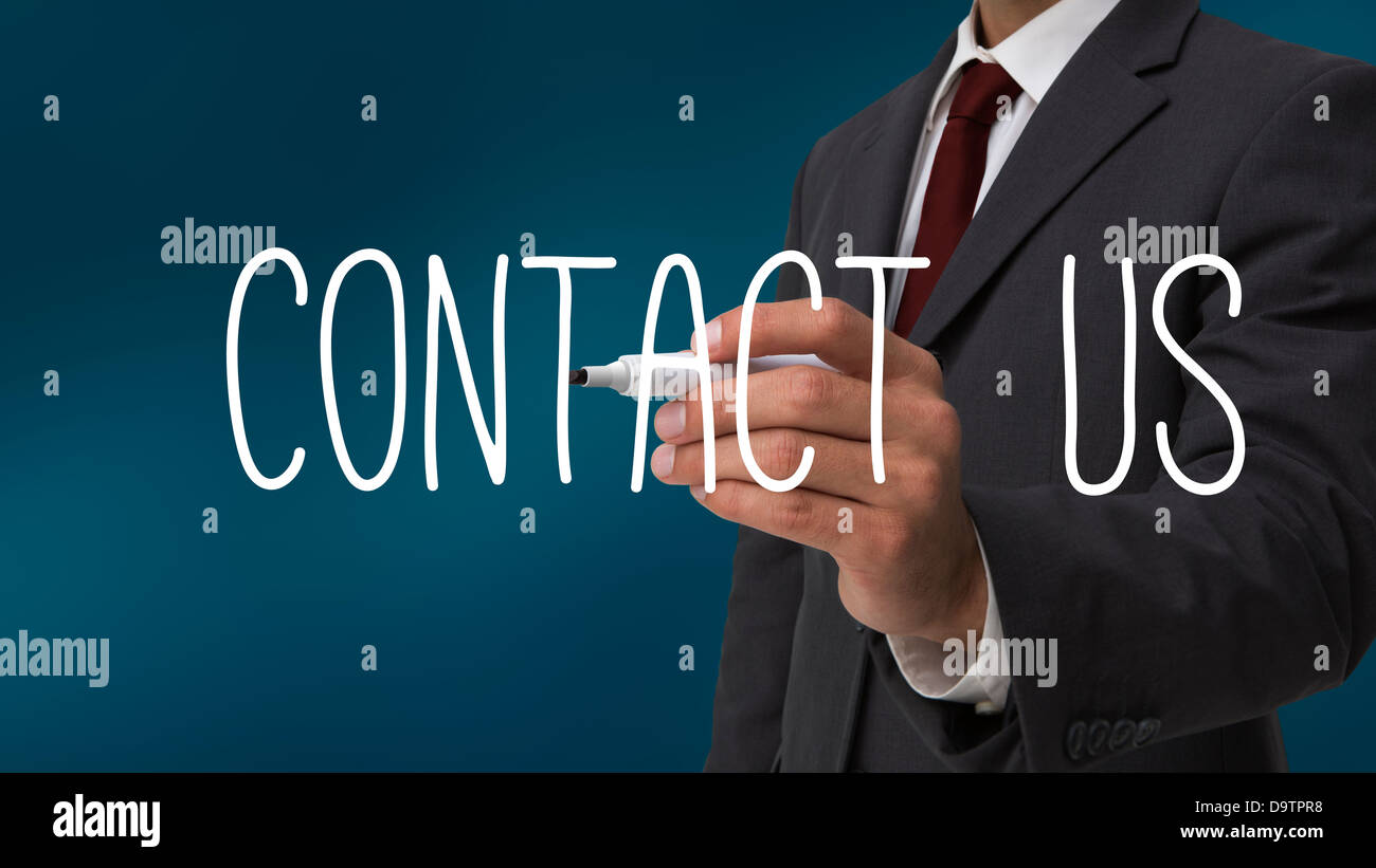 Businessman writing contact us Stock Photo - Alamy