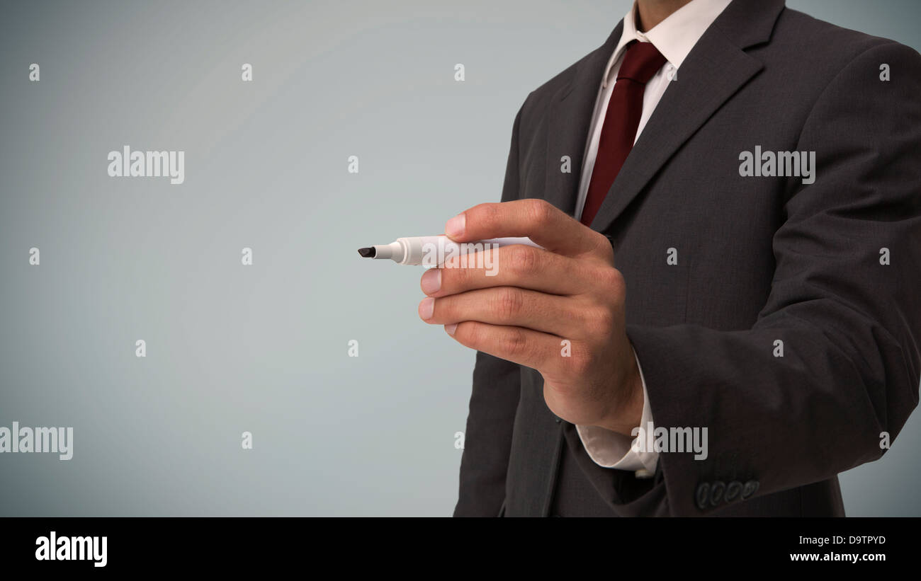 Businessman with a marker Stock Photo - Alamy
