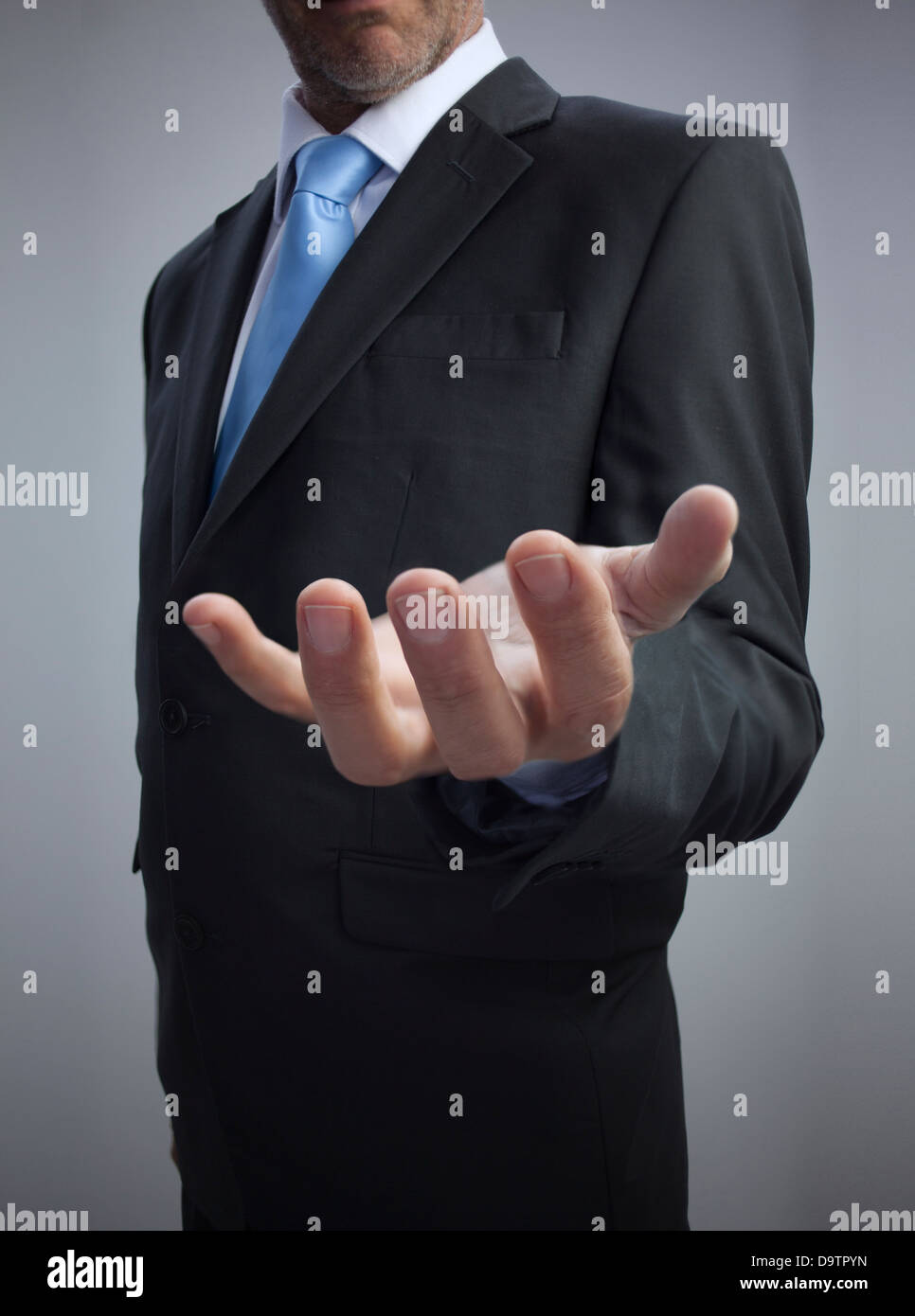 Businessman showing his empty hand Stock Photo - Alamy