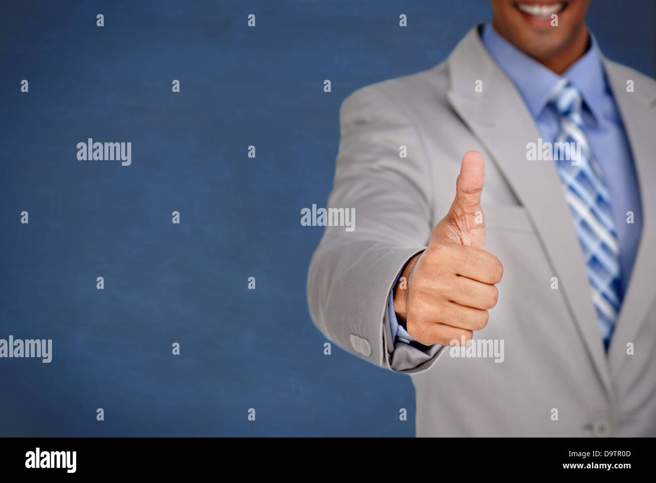Businessman giving thumbs up gesture hi-res stock photography and ...