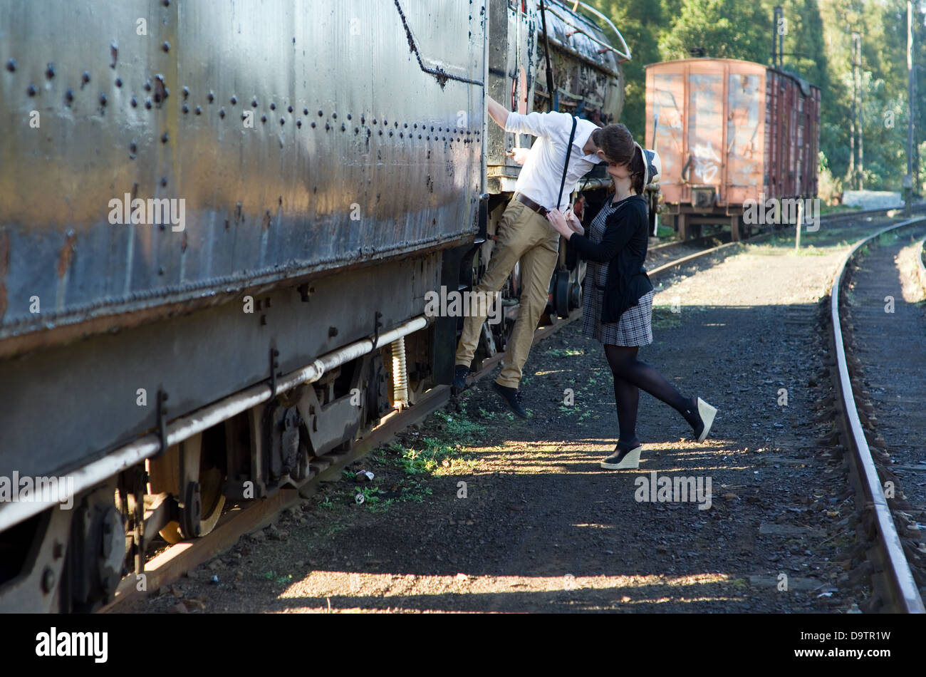 Young couple kissing train hi-res stock photography and images - Alamy