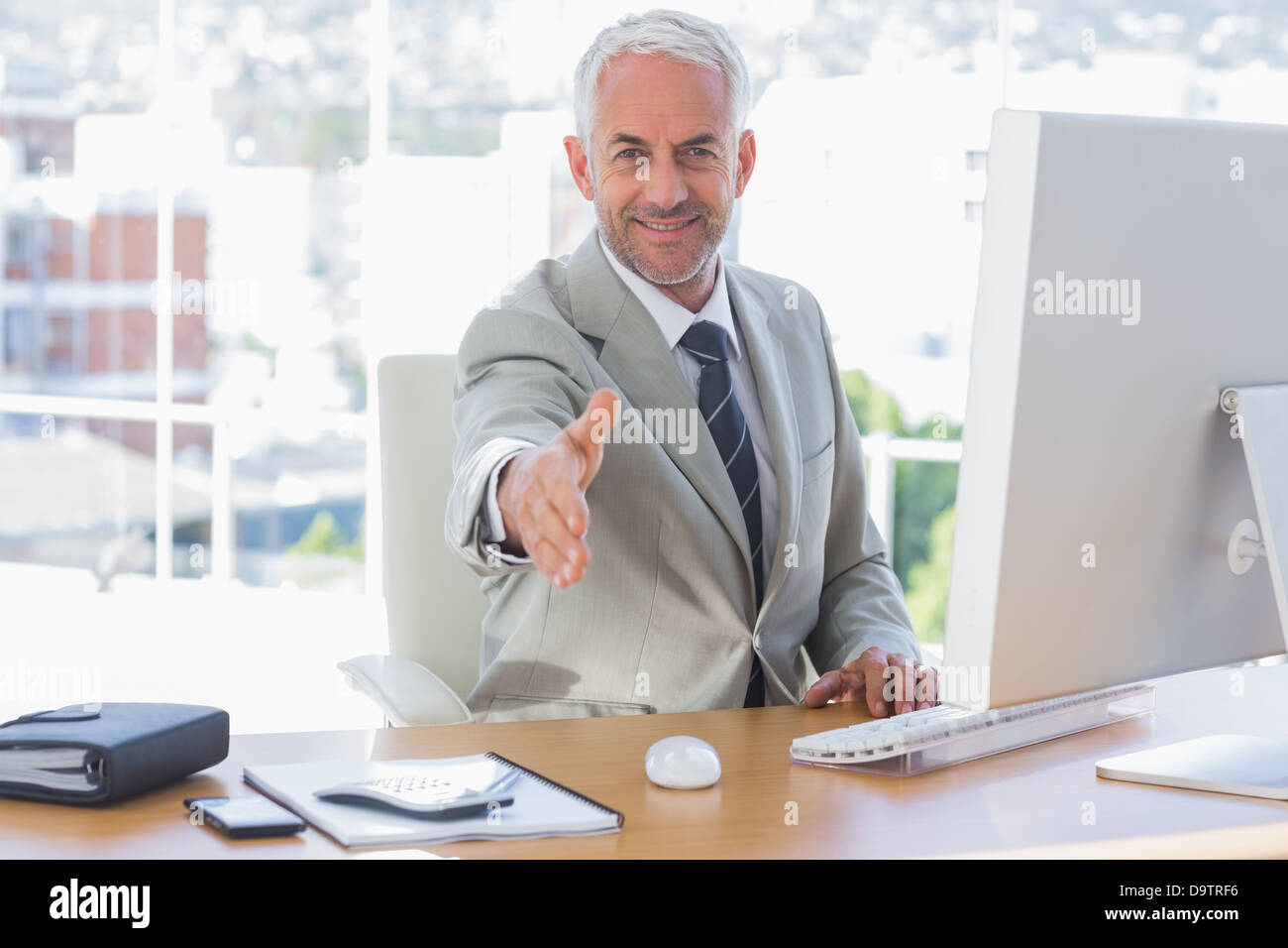 Hand reaching out computer monitor hi-res stock photography and images ...