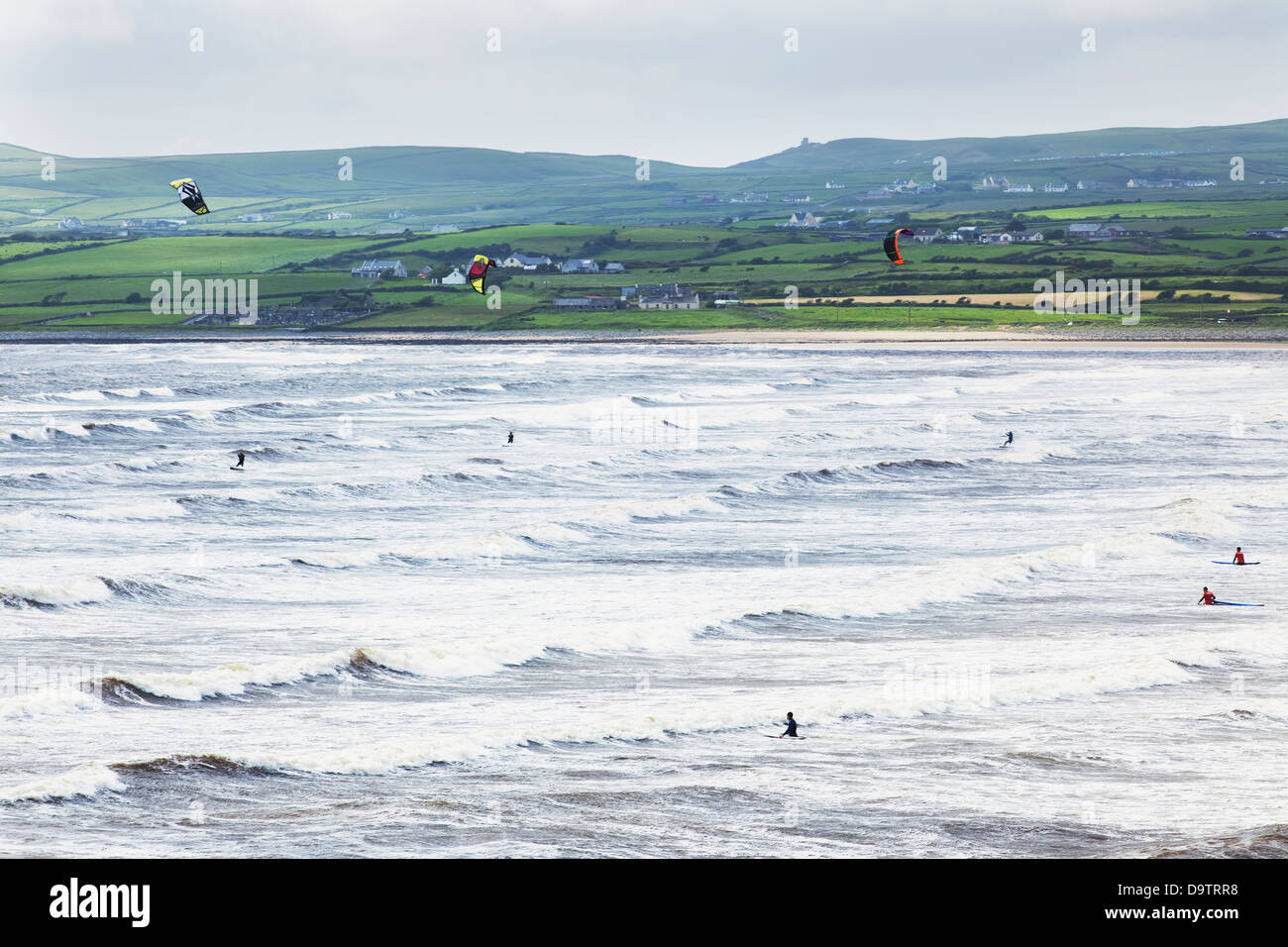Kitesurfers out on the waves in the choppy water;Lahinch county clare ...