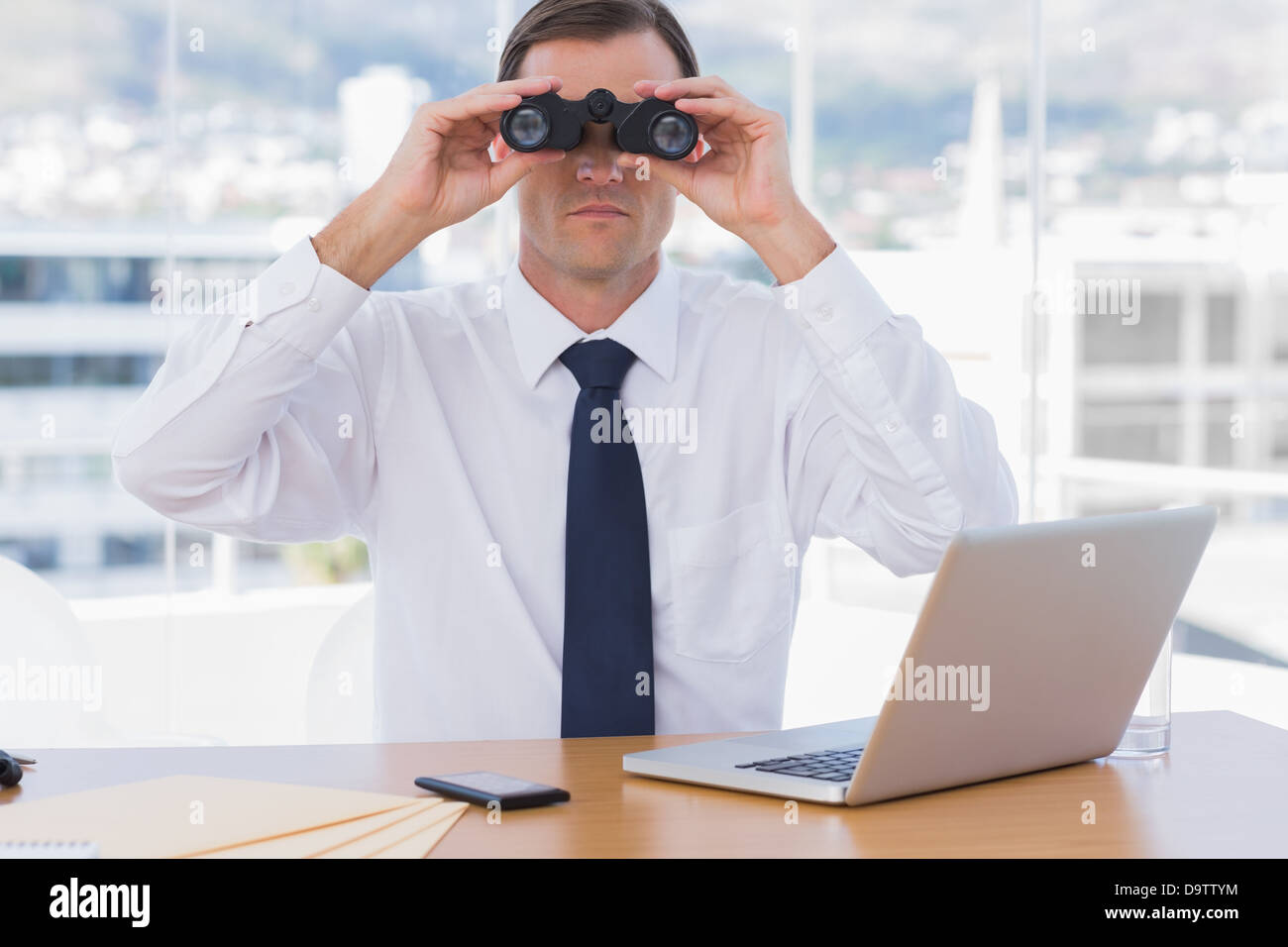 Man looking laptop binoculars hi-res stock photography and images - Alamy