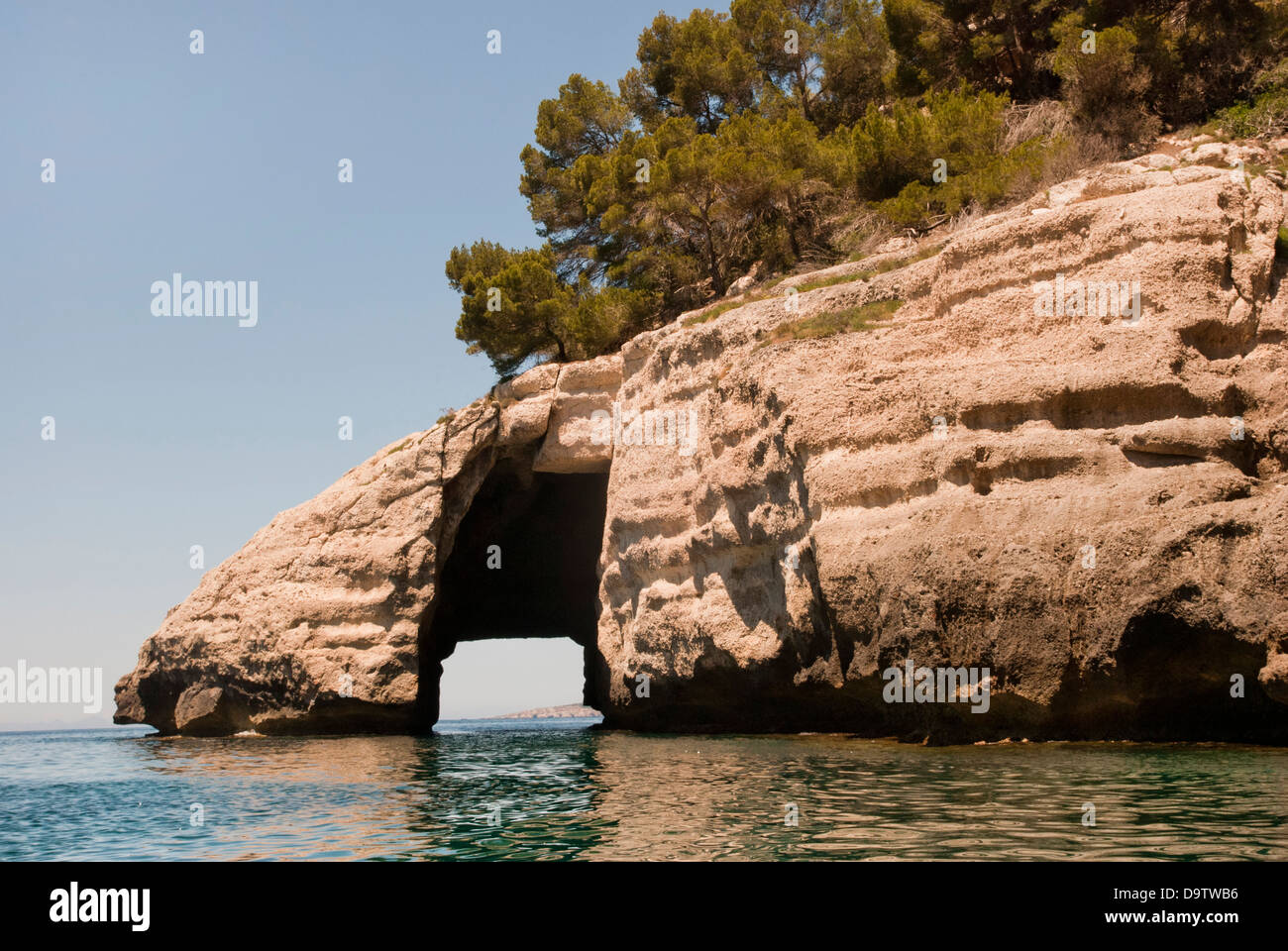cave in cliffs, menorca Stock Photo - Alamy