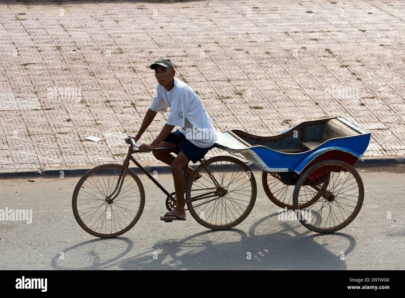 Rickshaw Driver on the Riverfront in Kampot, Cambodia Stock Photo - Alamy