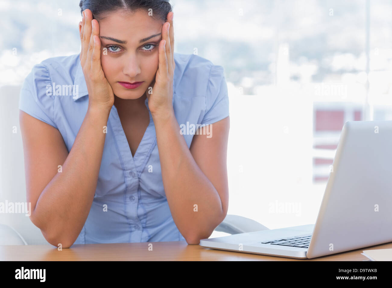 Woman head in hands sad computer hi-res stock photography and images ...