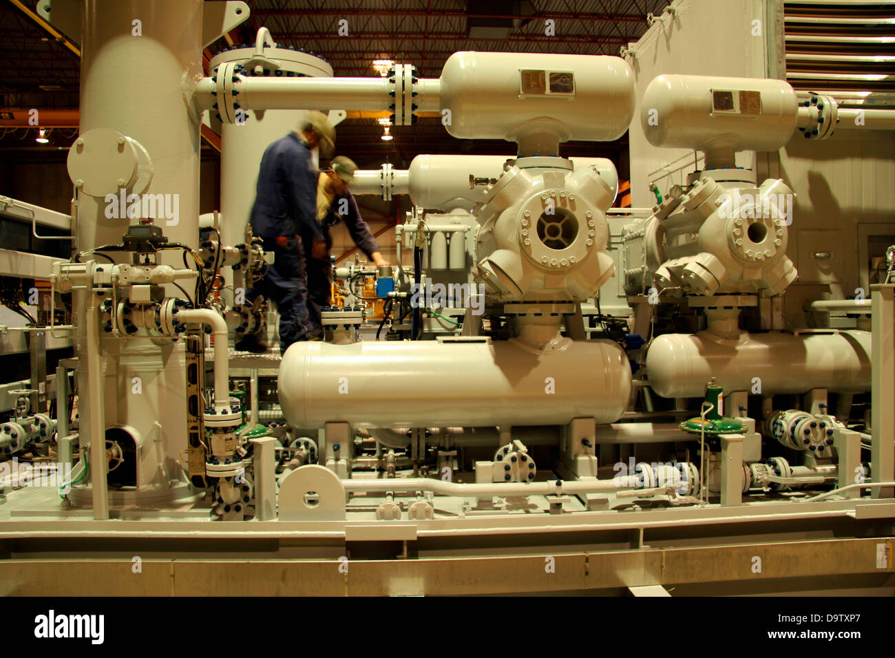 Natural gas compressor station with two working technicians Stock Photo ...