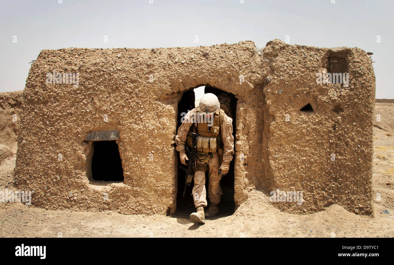 A US Marine clears a compound during Operation Northern Lion June 24 ...