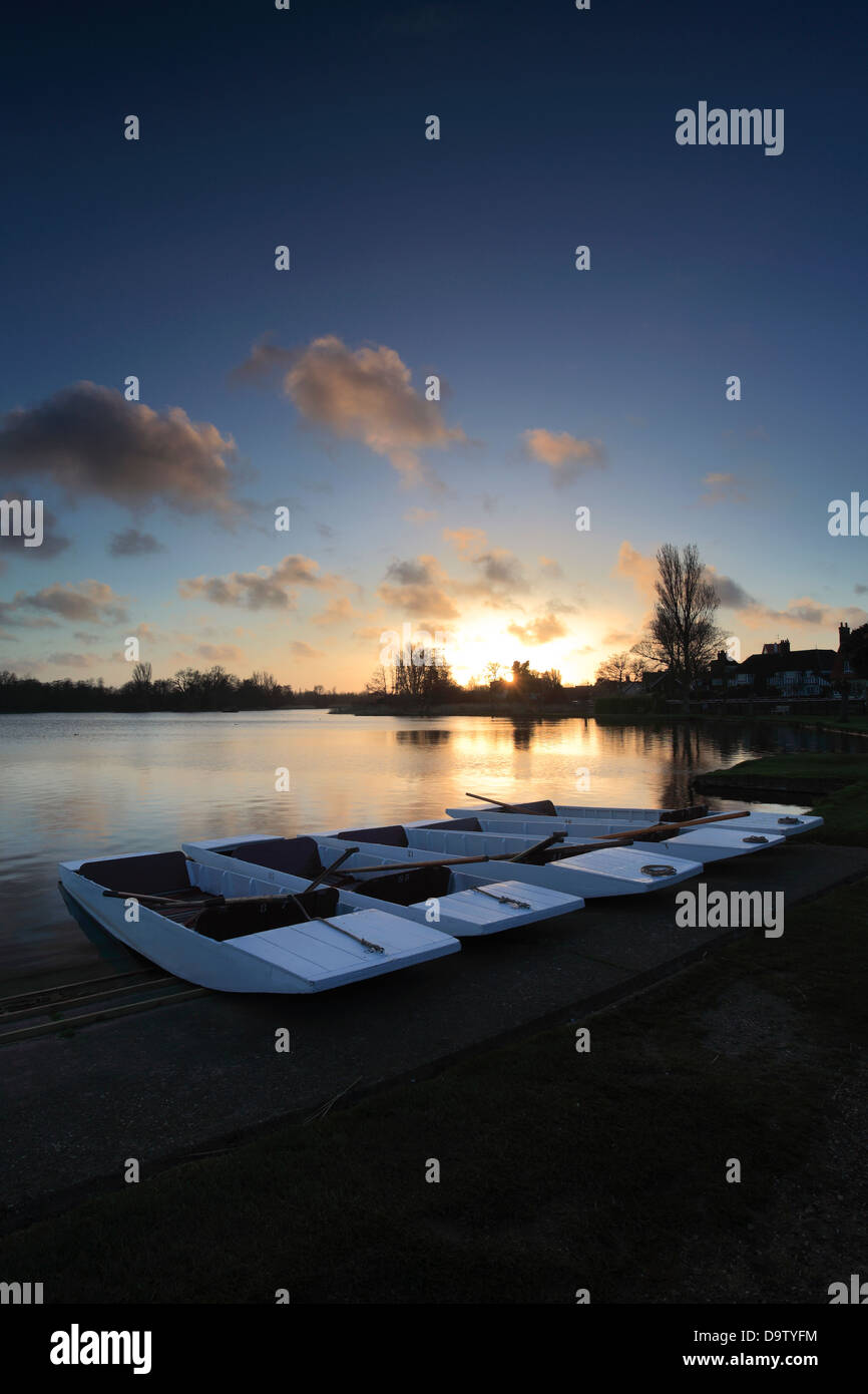 Colourful wooden rowing boats for hire on the Mere at Thorpeness ...