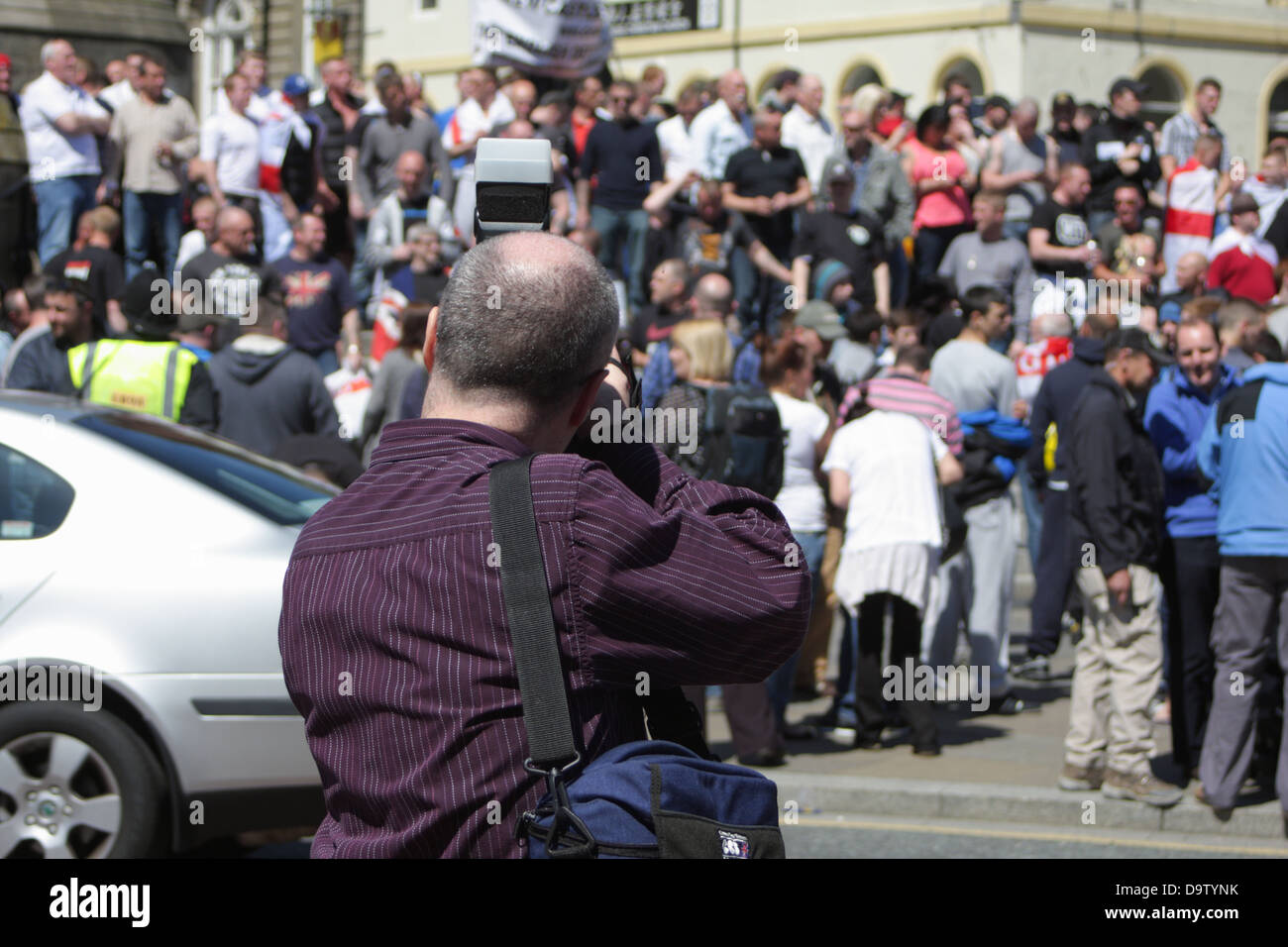 A man taking photographs at a EDL demonstration, newcastle upon tyne ...