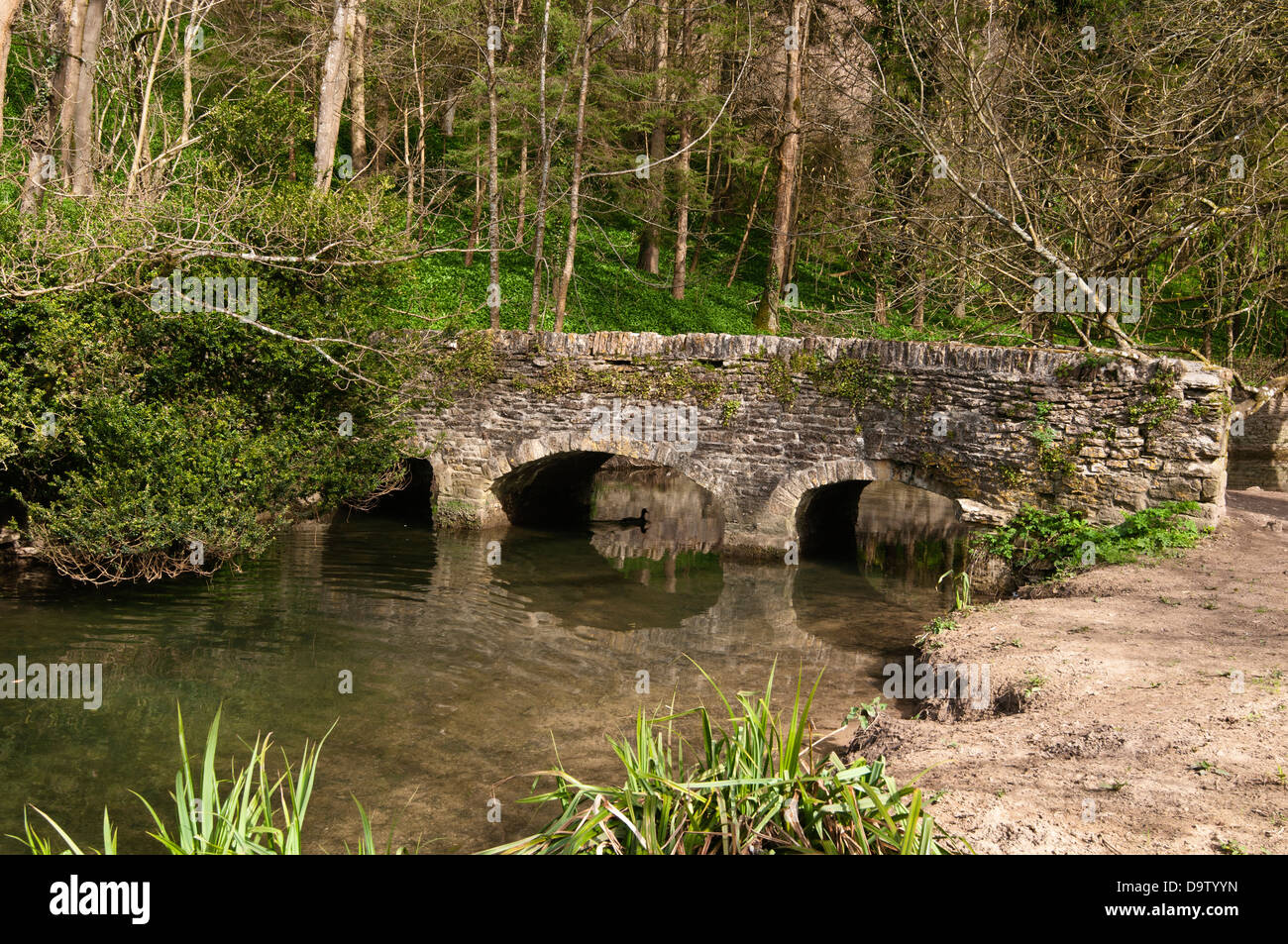 A Small Bridge over Bybrook River Castle Combe Wiltshire England UK ...