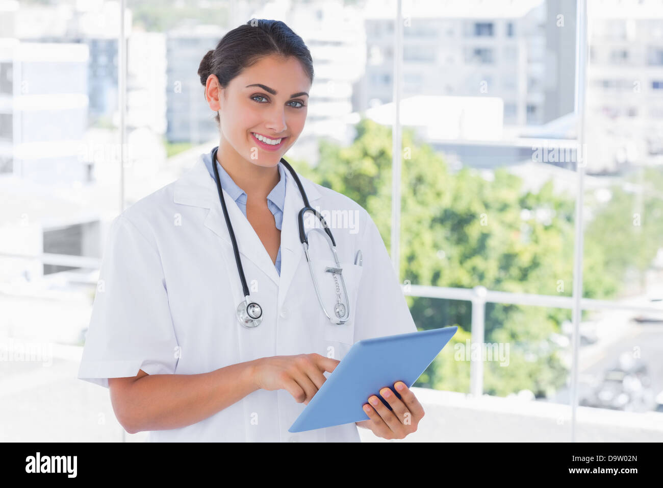 Young happy woman doctor using hi-res stock photography and images - Alamy