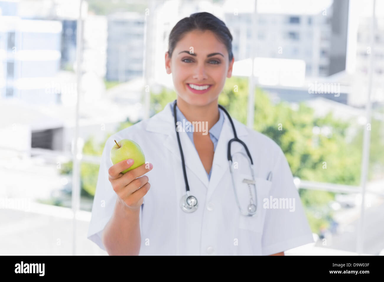 Portrait of a young woman eating an apple hi-res stock photography and ...