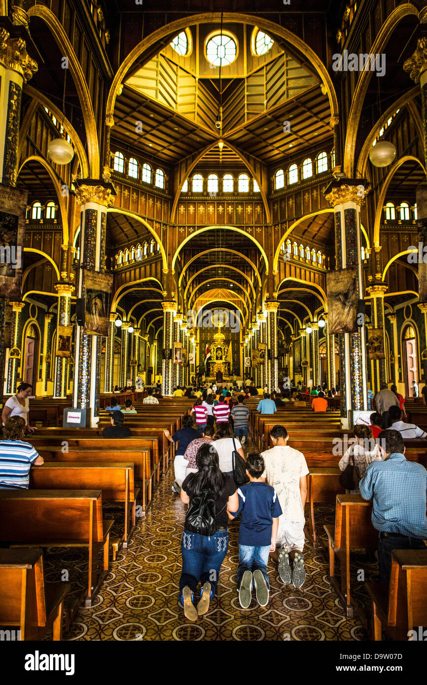 Worshipers praying at the Basilica Nuestra Senora De Los Angeles ...