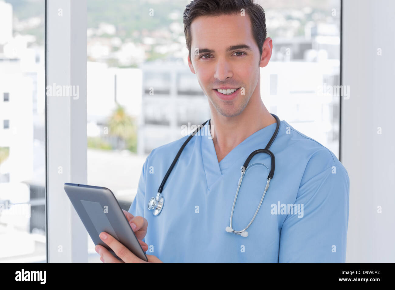 Portrait nurse holding digital hi-res stock photography and images - Alamy
