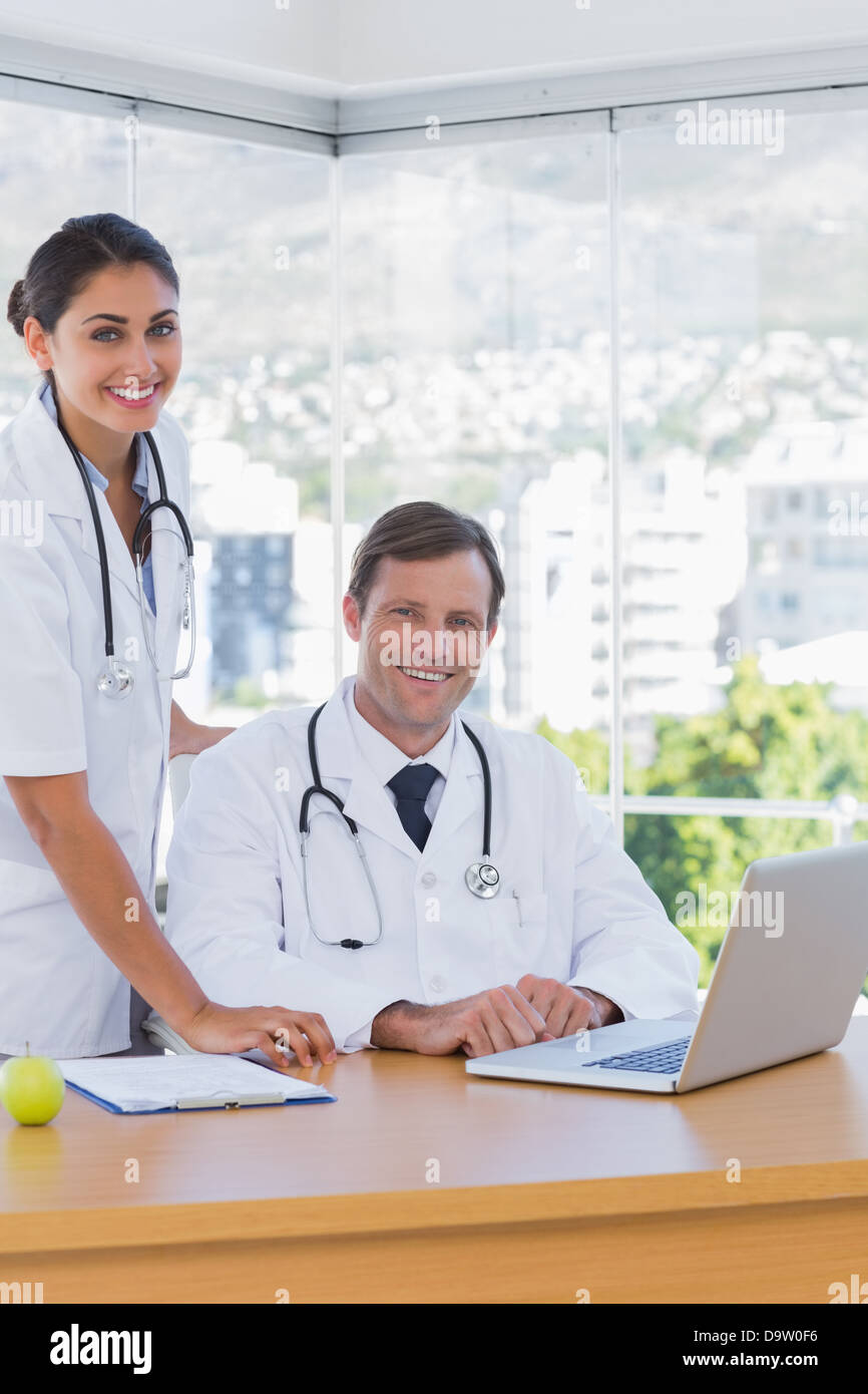 Cheerful young office employees hi-res stock photography and images - Alamy