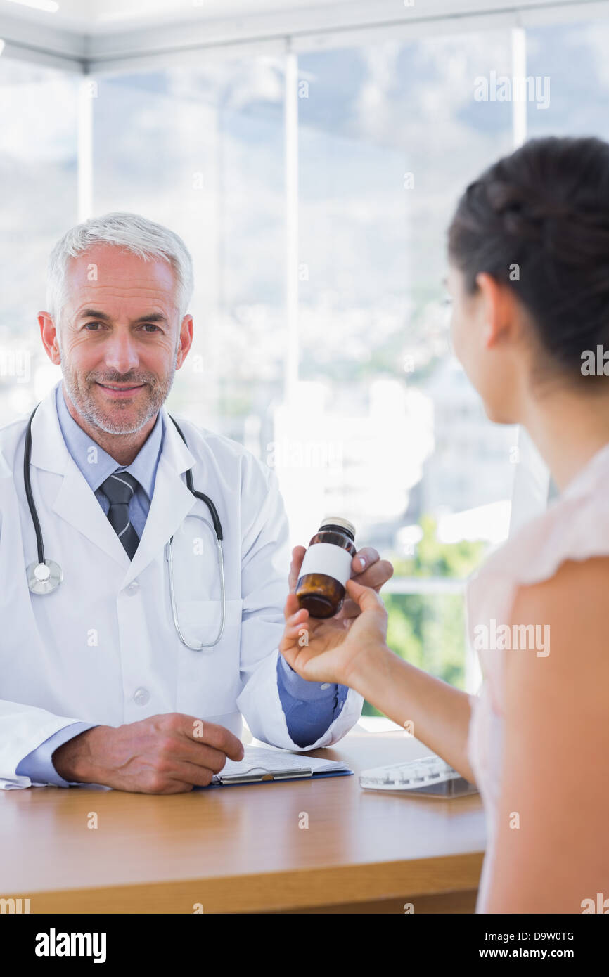 Doctor handing drugs patient hi-res stock photography and images - Alamy