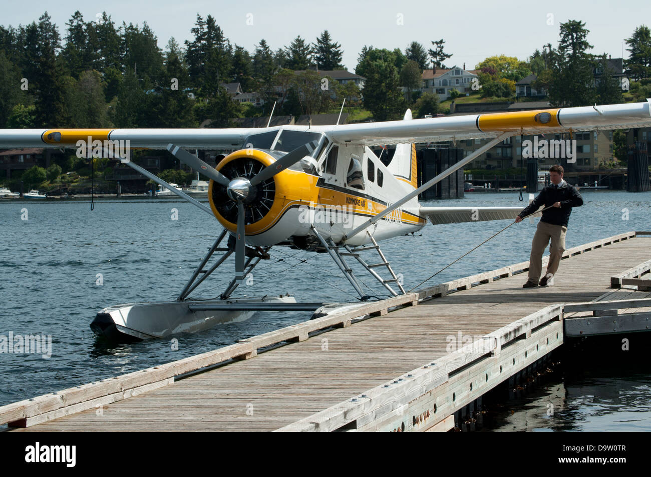 Float Plane pilot securing his aircraft at Friday Harbor Marina, Friday ...