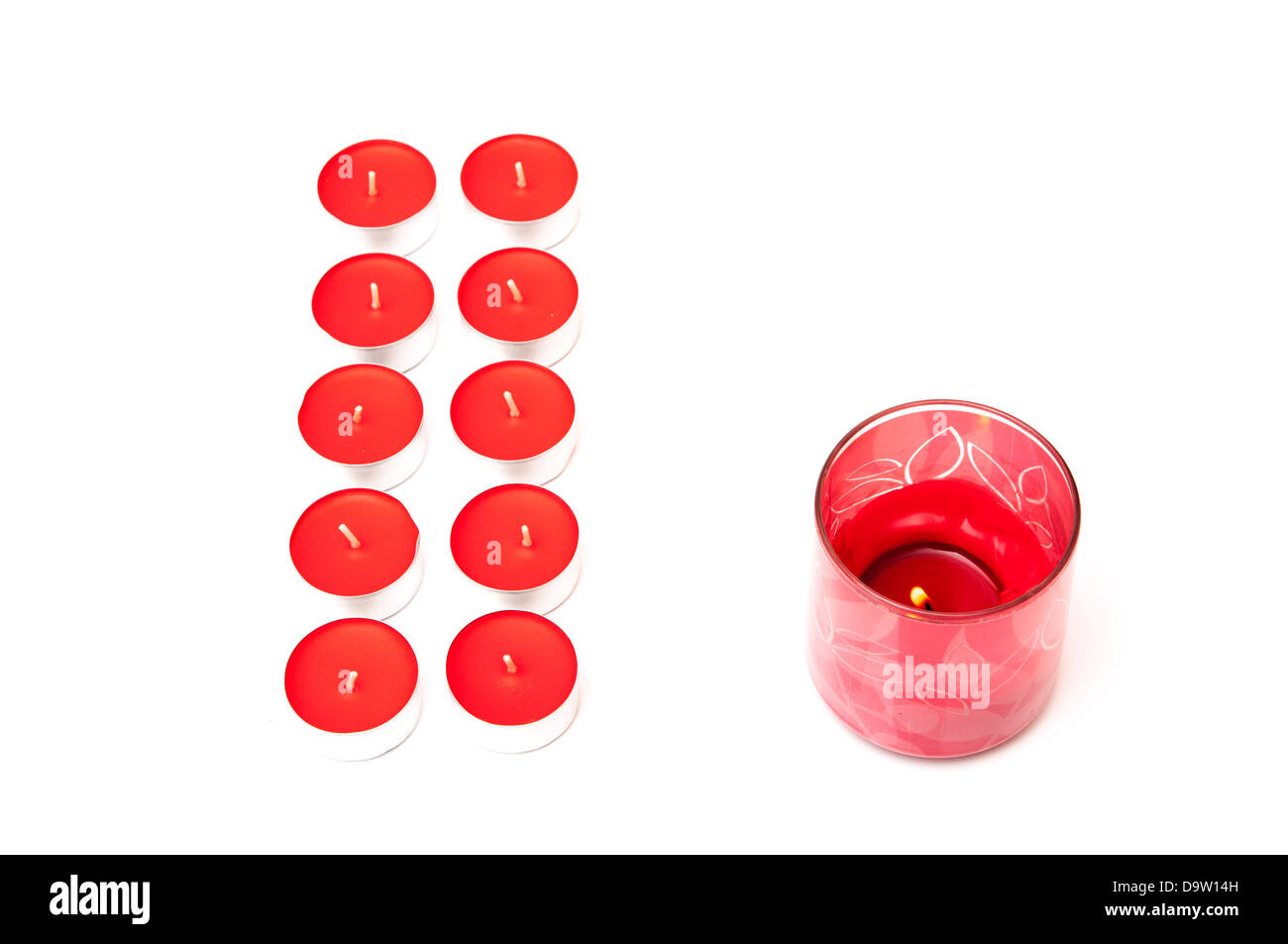 red colored candles on a white background Stock Photo - Alamy