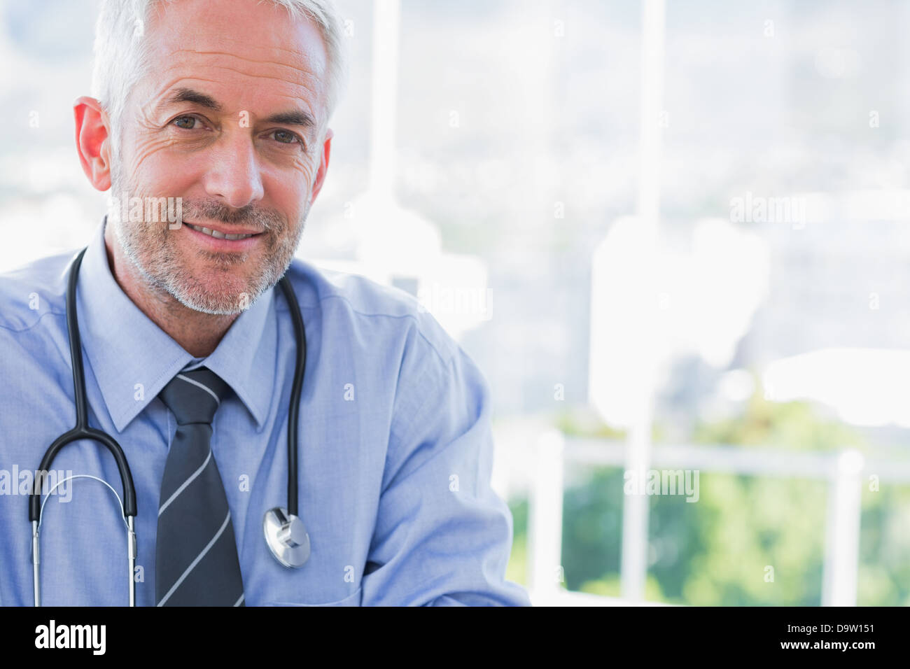 Portrait of a smiling doctor Stock Photo - Alamy