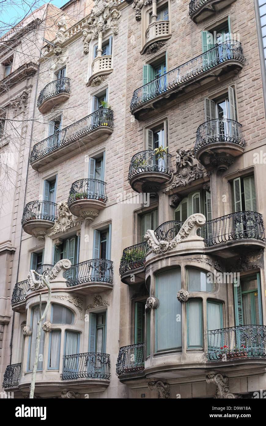 Ornate stonework and wrought iron on apartment building in Barcelona ...