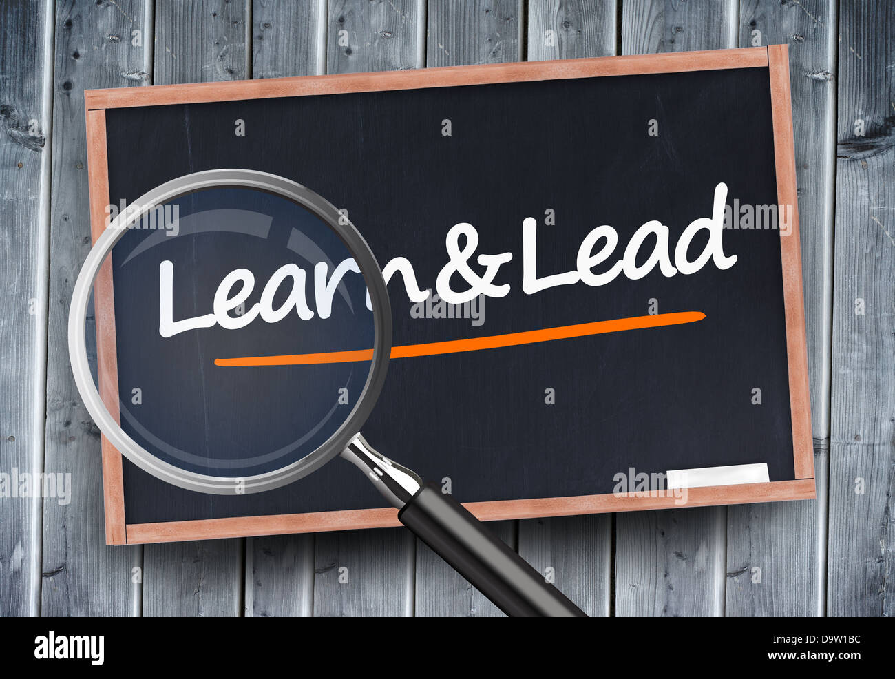 Learn and lead written on a blackboard Stock Photo - Alamy