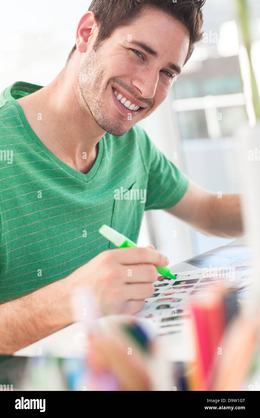 Photo editor looking contact hi-res stock photography and images - Alamy
