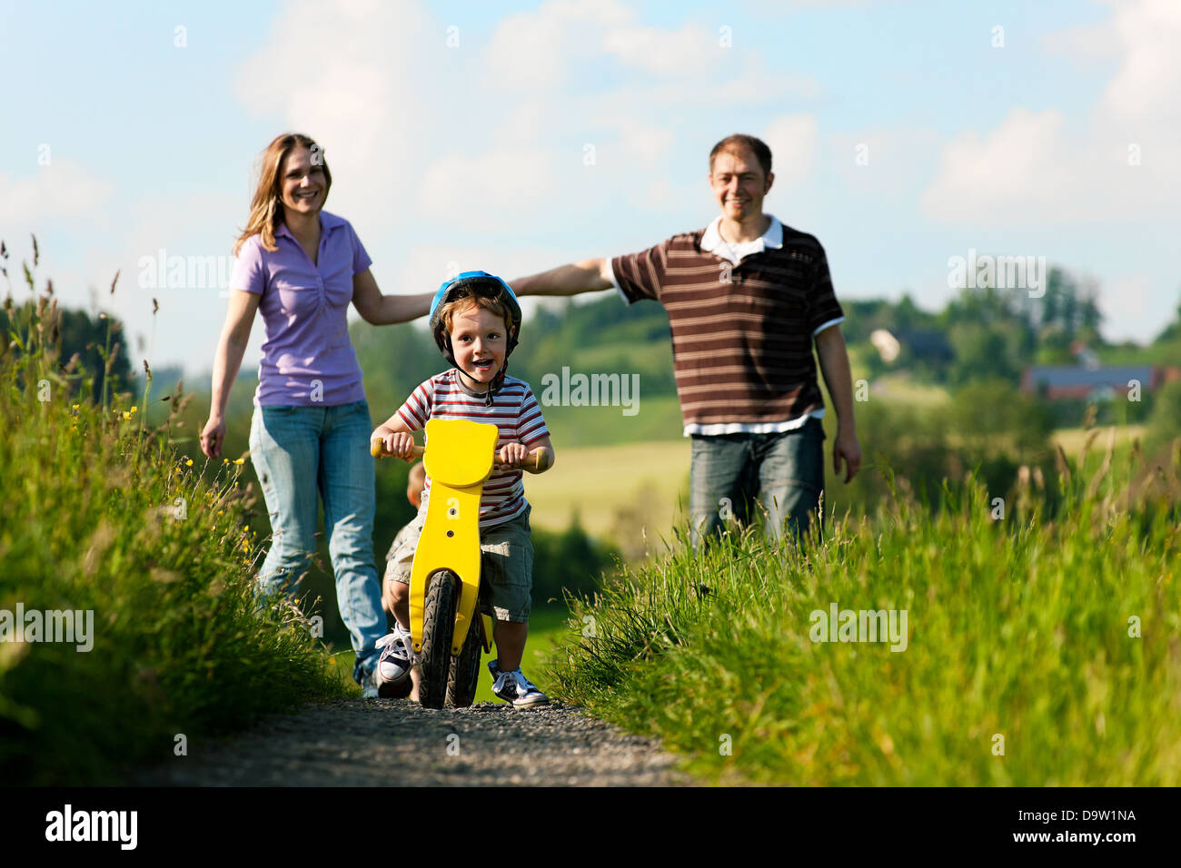 Family with boy child having a weekend excursion, the parents are ...