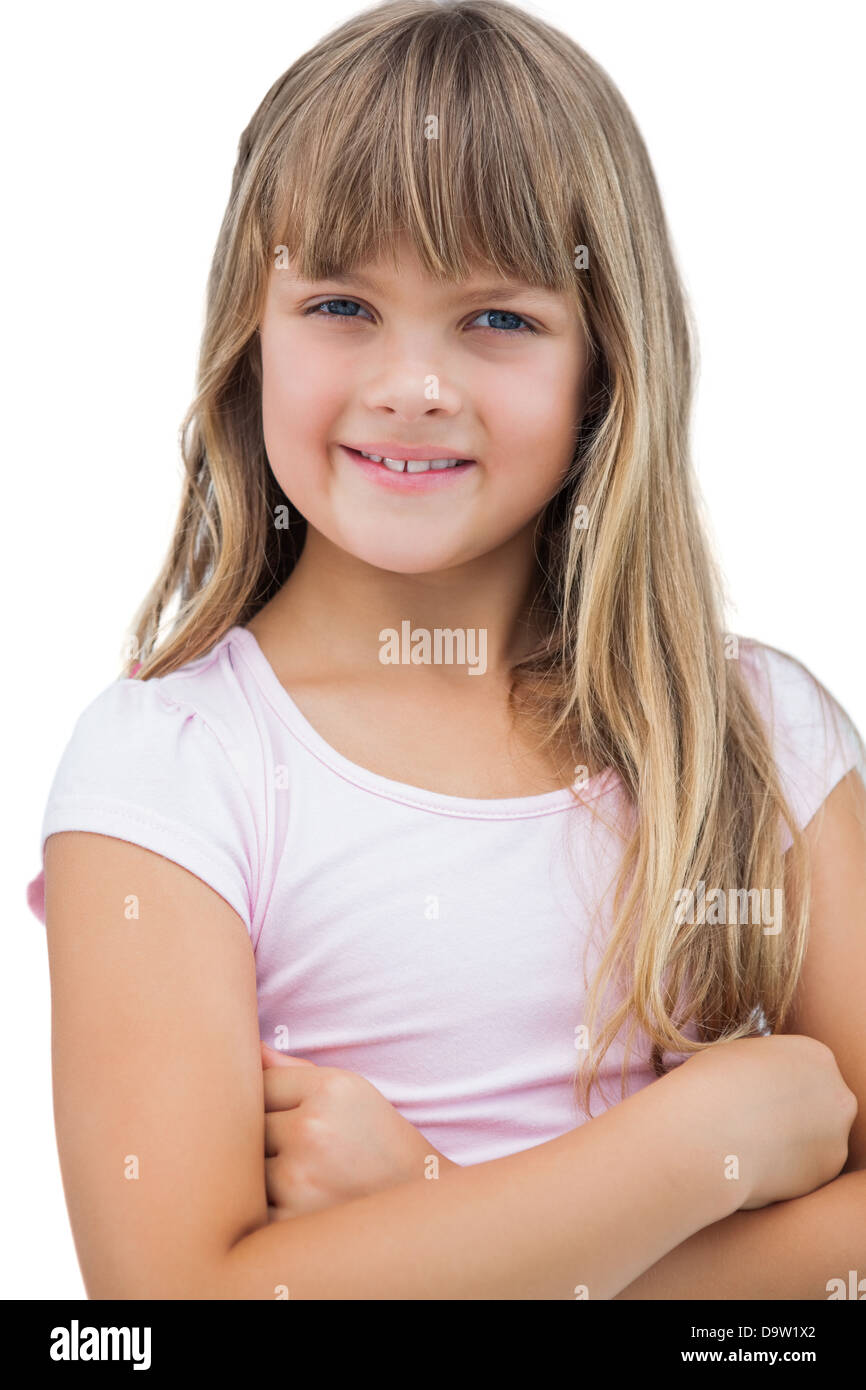 Beautiful little girl smiling with her arms crossed Stock Photo - Alamy