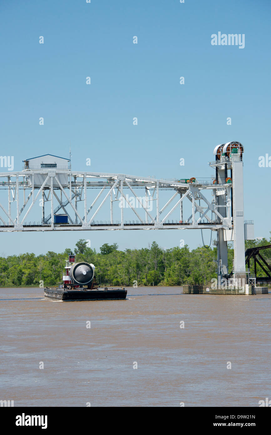 Alabama, Mobile. Mobile River barge traffic with railroad bridge Stock ...