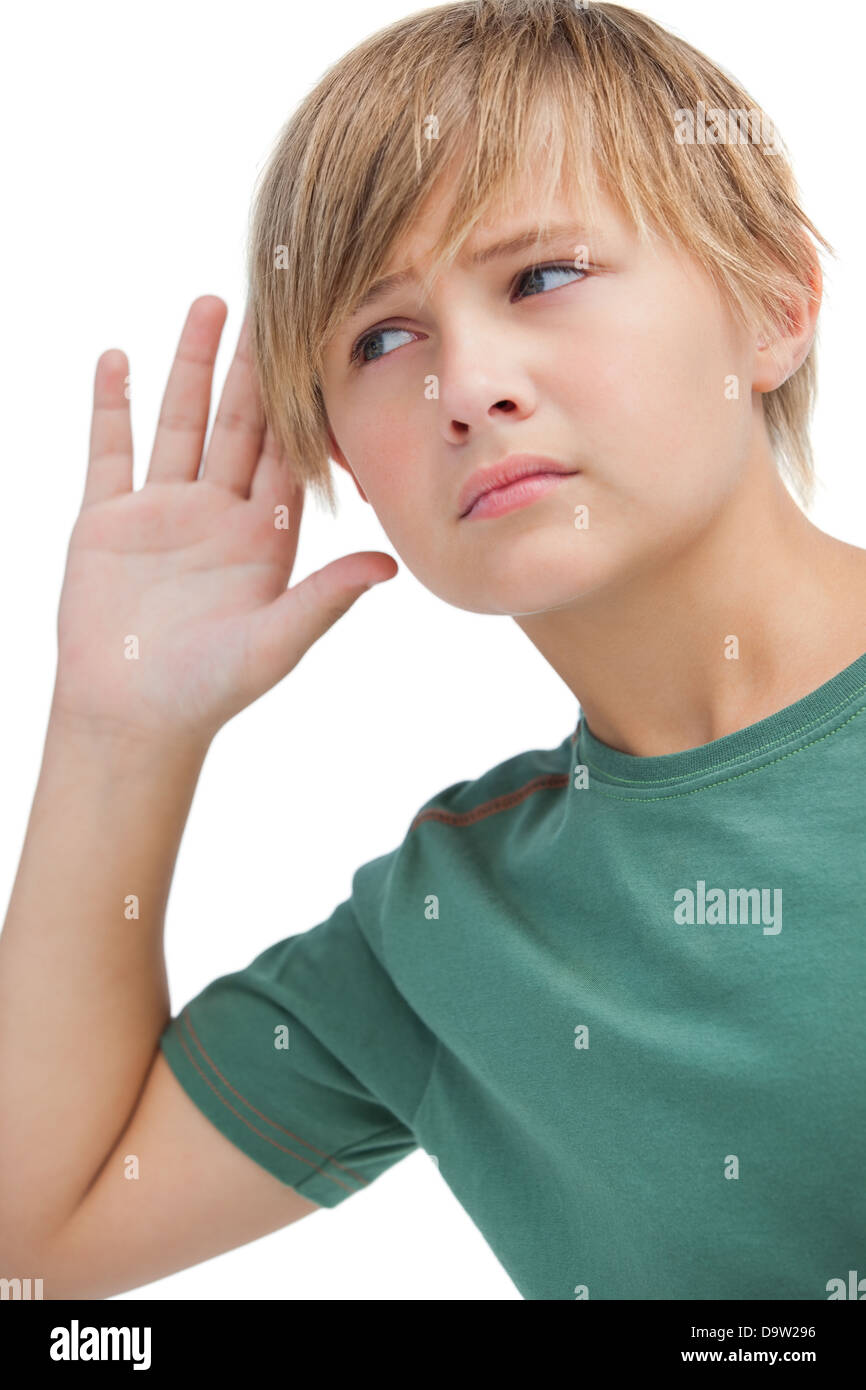 Little boy listening and looking at something Stock Photo - Alamy