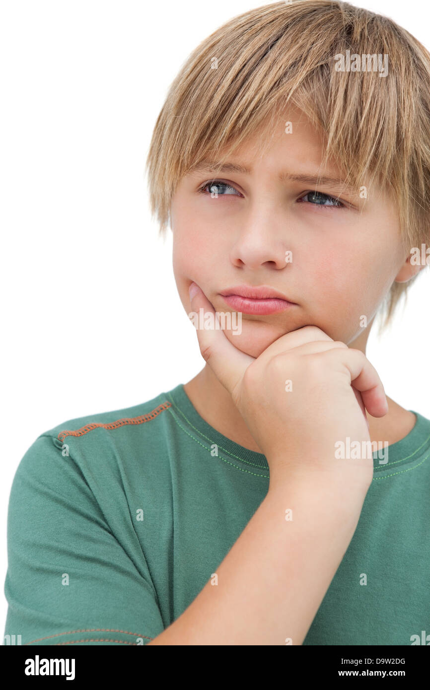 Young boy thinking about something Stock Photo - Alamy