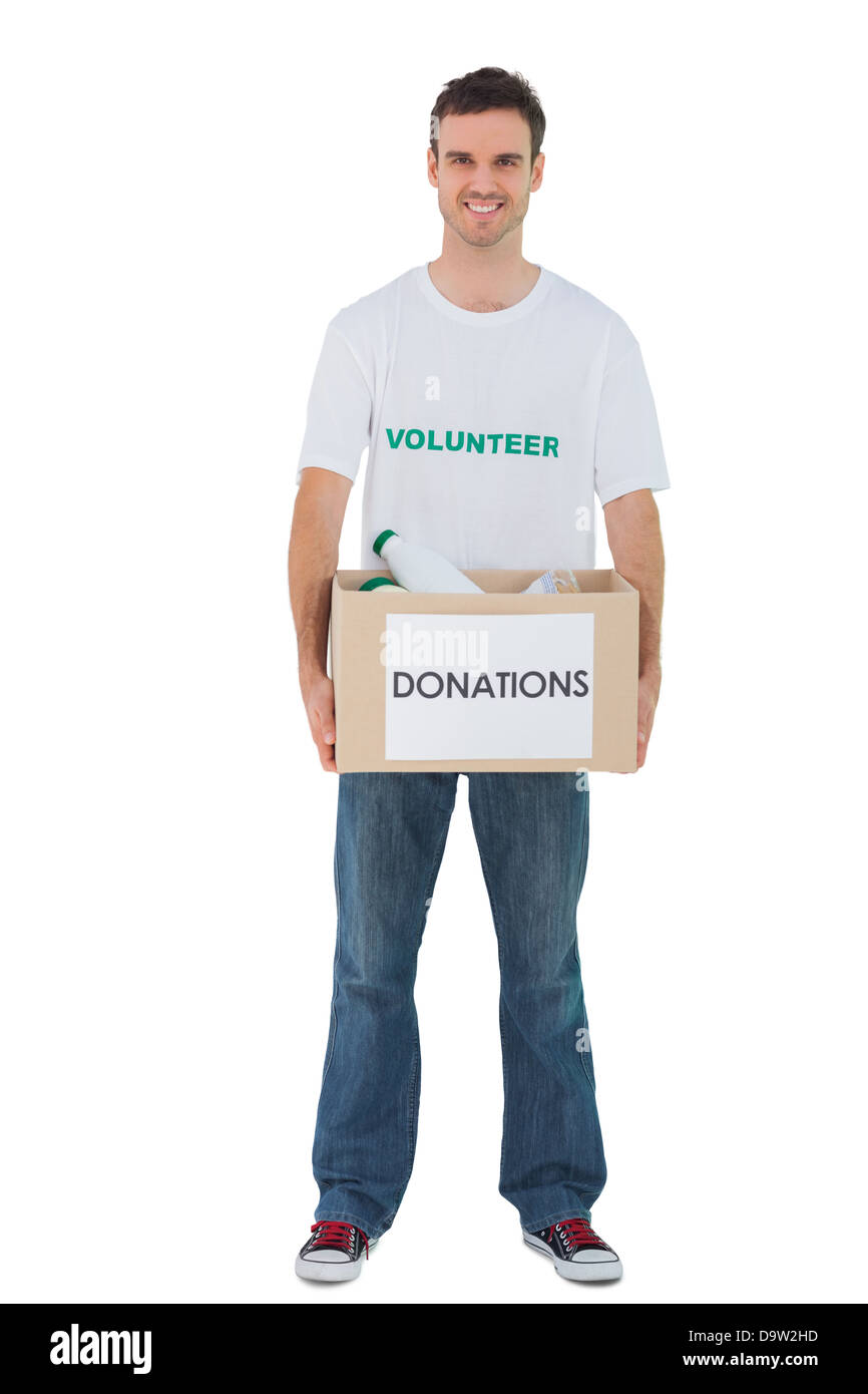 Handsome man carrying donation box with bottles Stock Photo - Alamy