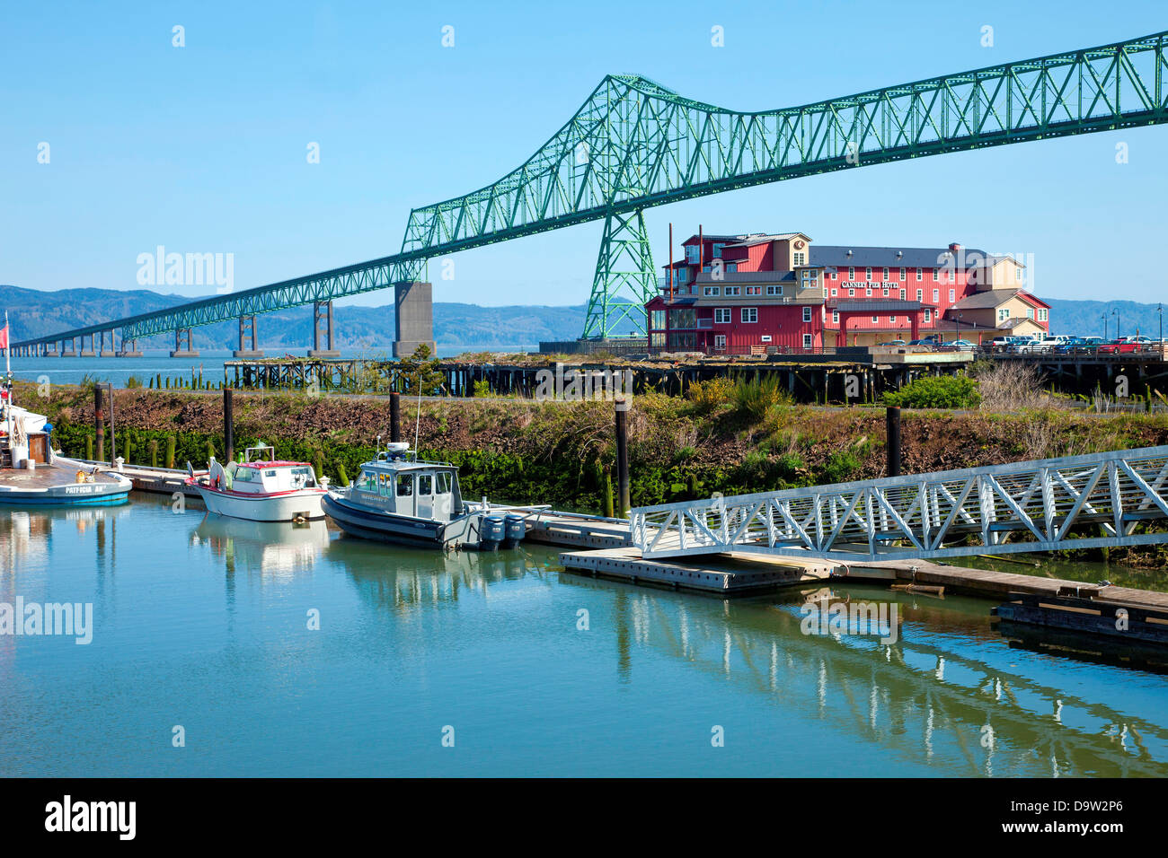 The Astoria bridge old cannery hotel and a small marina Stock Photo - Alamy