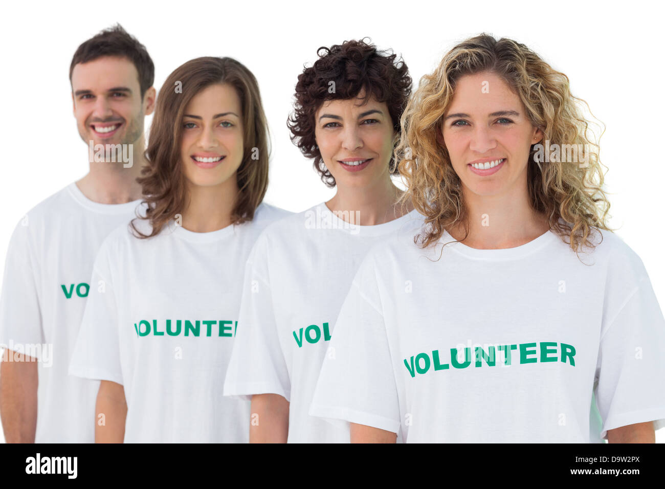 Four people wearing volunteer tshirt Stock Photo - Alamy
