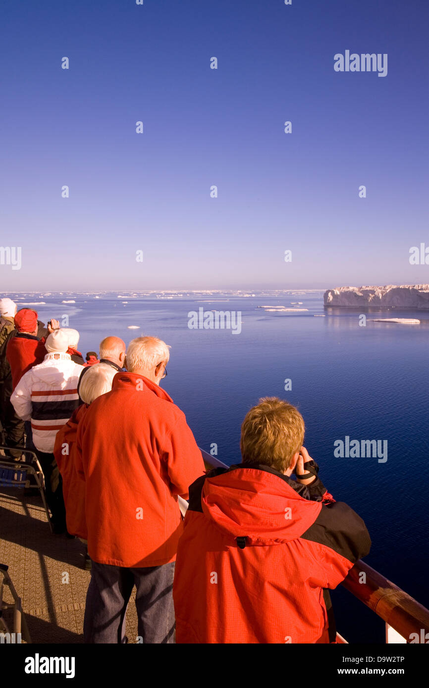 Passengers onboard MS FRAM in the narrow Smith Sound between Greenland ...