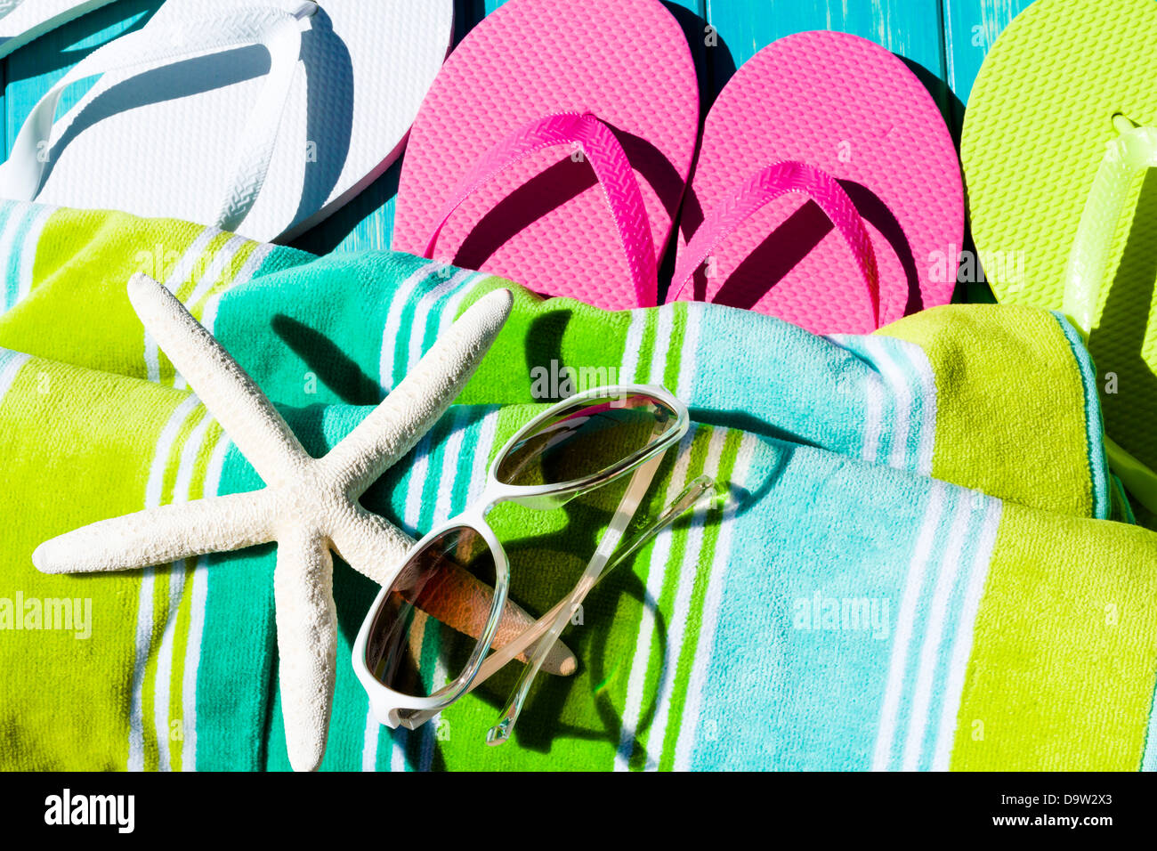 Colorful flip flops by a swimming pool Stock Photo - Alamy