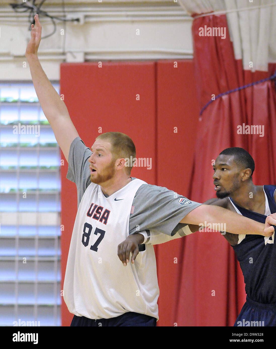 June 25, 2013 - Colorado Springs, NM, U.S. - UNM's Alex Kirk raises his ...