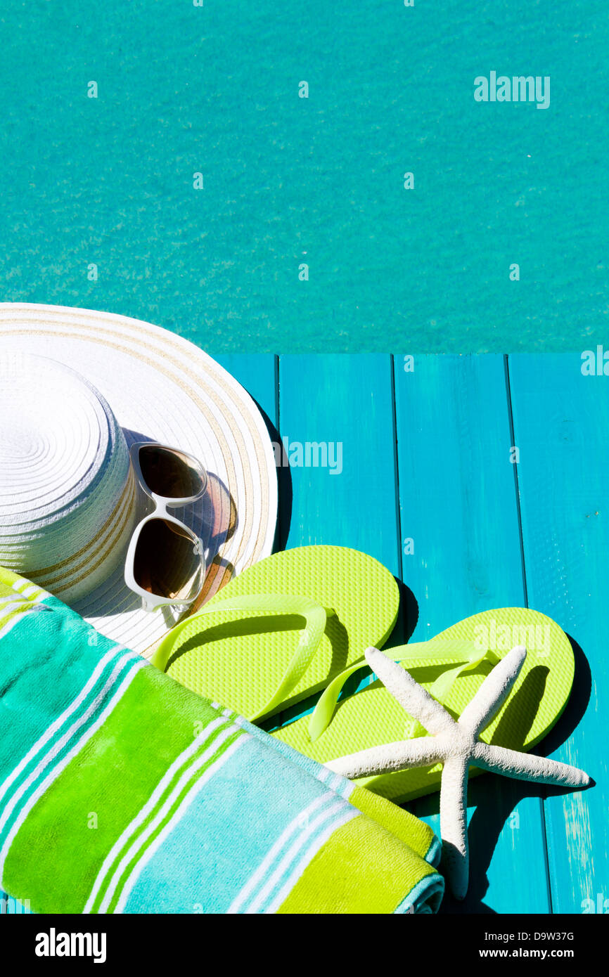 Colorful flip flops by a swimming pool Stock Photo - Alamy
