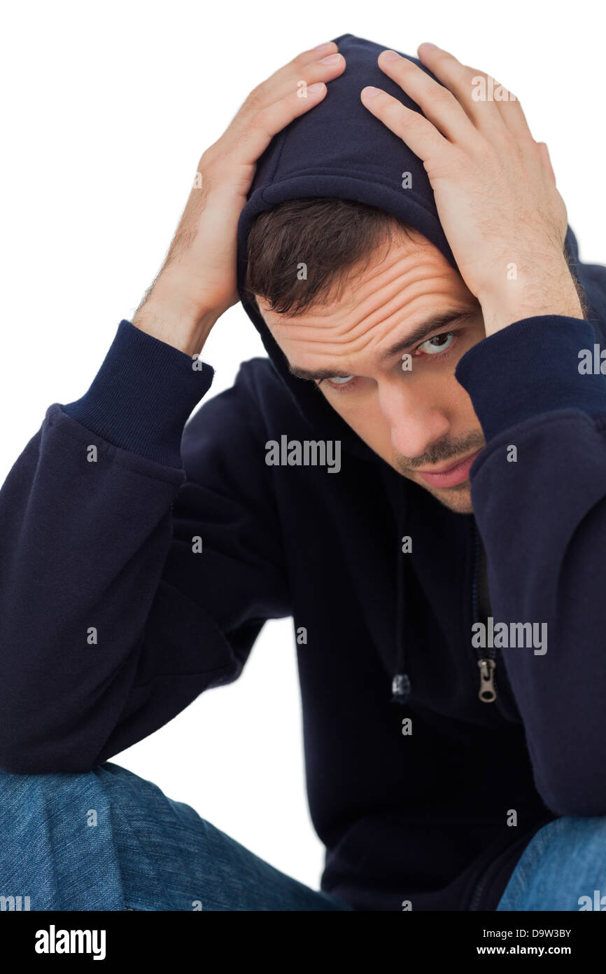 Worried man with head in hands Stock Photo - Alamy