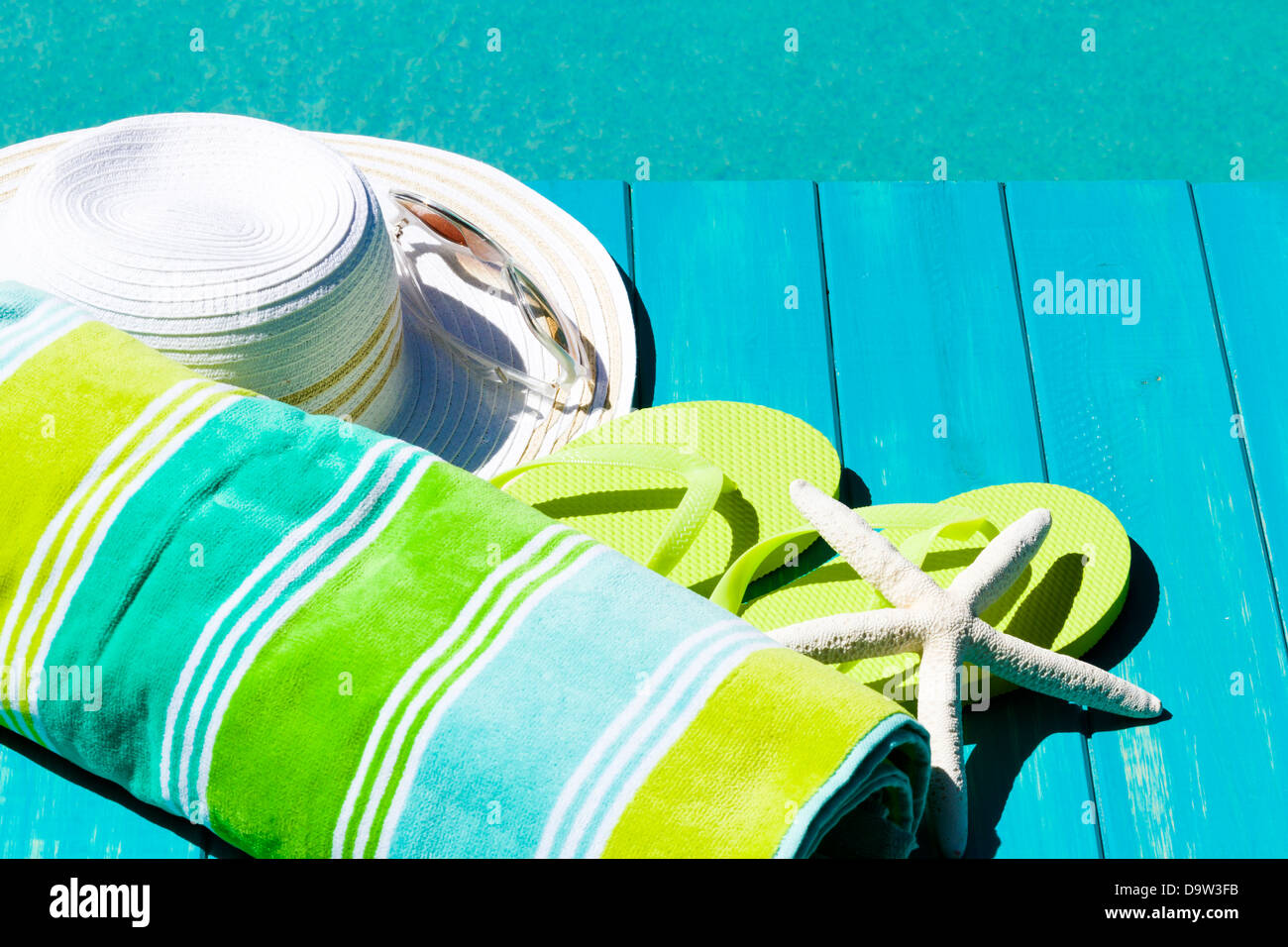 Colorful flip flops by a swimming pool Stock Photo - Alamy