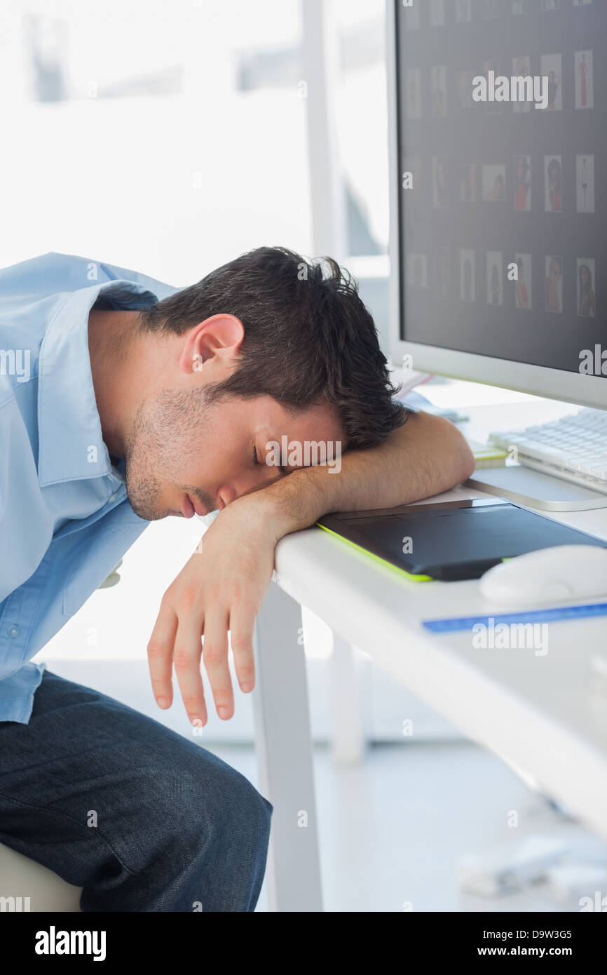 Graphic designer sleeping on his keyboard Stock Photo - Alamy
