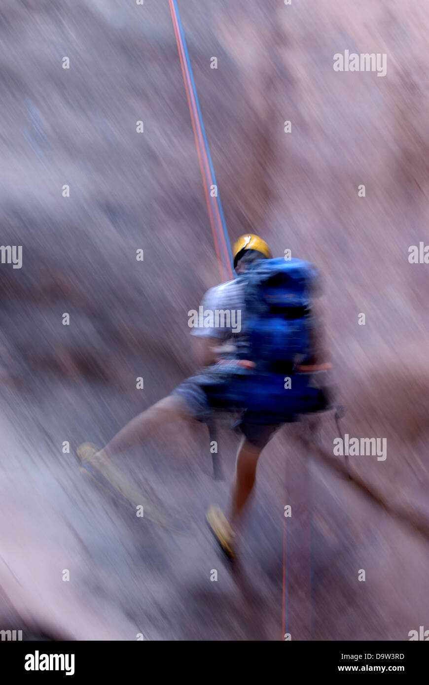 Tourist hanging from a rope while canyoning in the area of the ...
