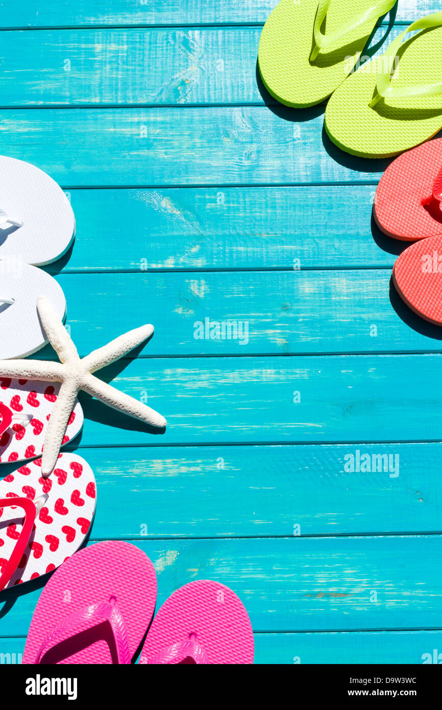 Colorful flip flops by a swimming pool Stock Photo - Alamy