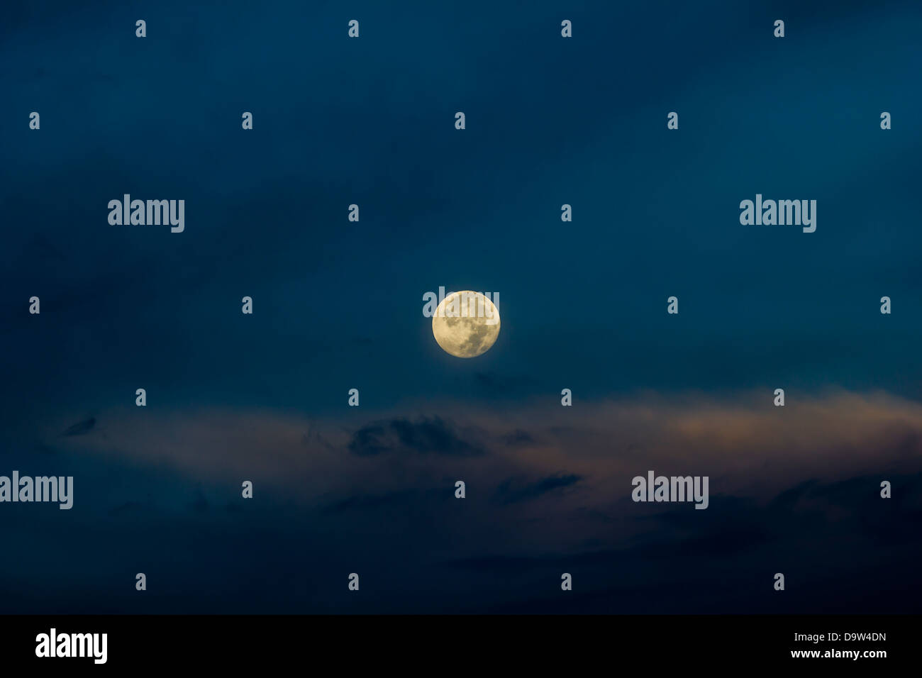 Full moon in the clouds Stock Photo - Alamy