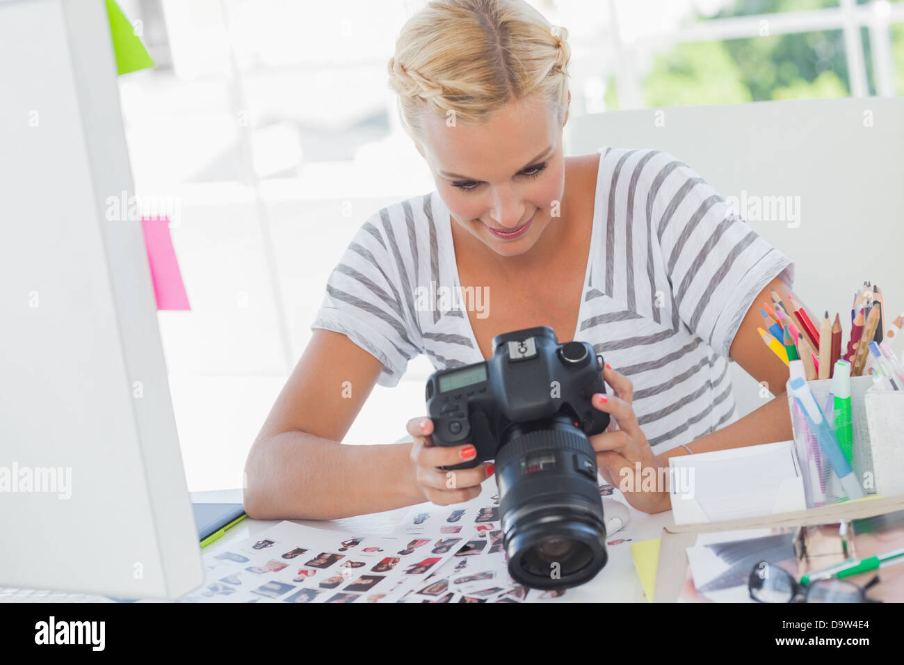 Photo editor looking contact hi-res stock photography and images - Alamy