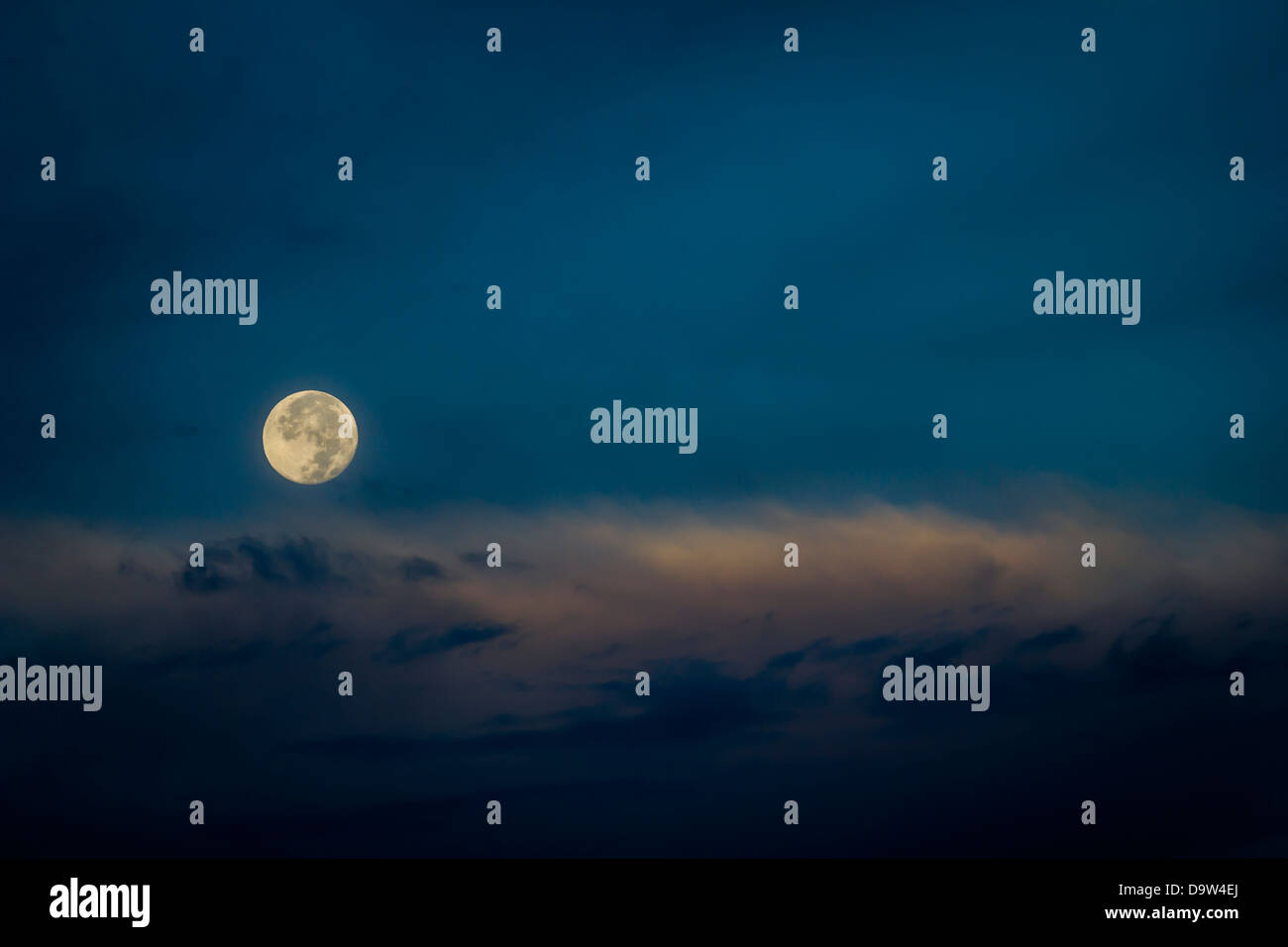 Full moon in the clouds Stock Photo - Alamy